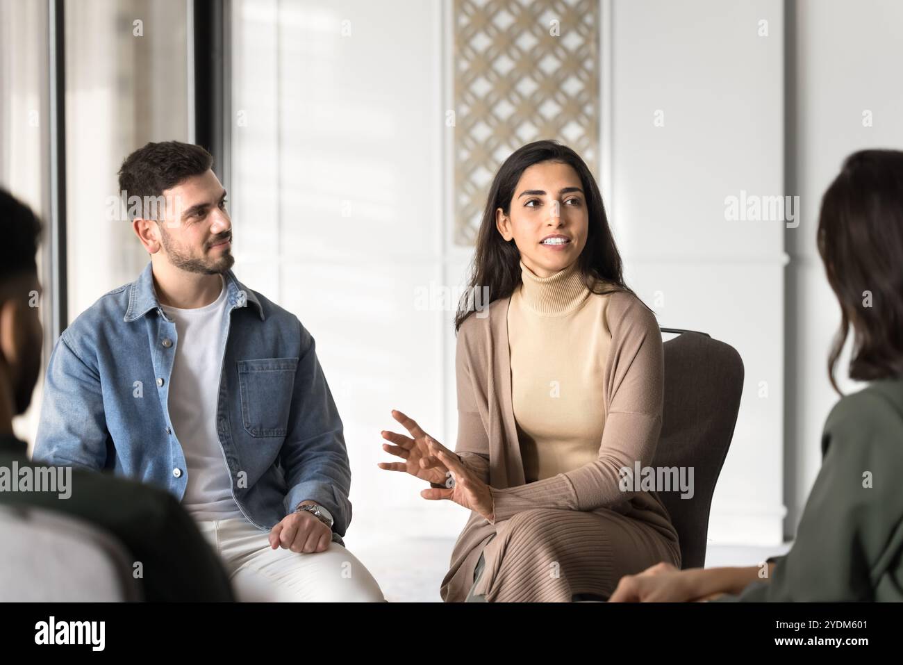 Group therapy female Latin doctor talking to diverse patients Stock ...
