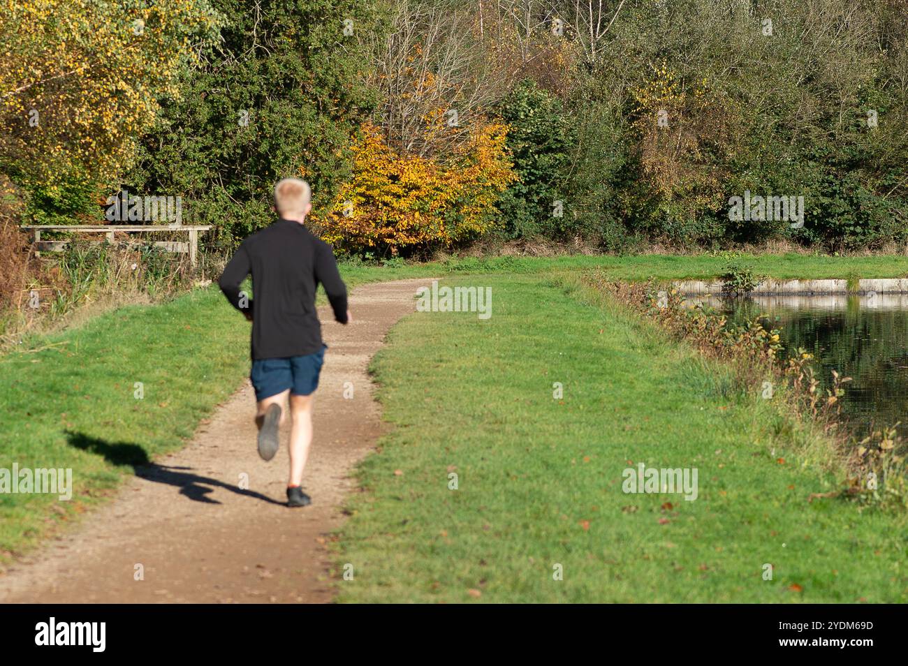 Englefield Green, UK. 27th October, 2024. A jogger out first thing in ...