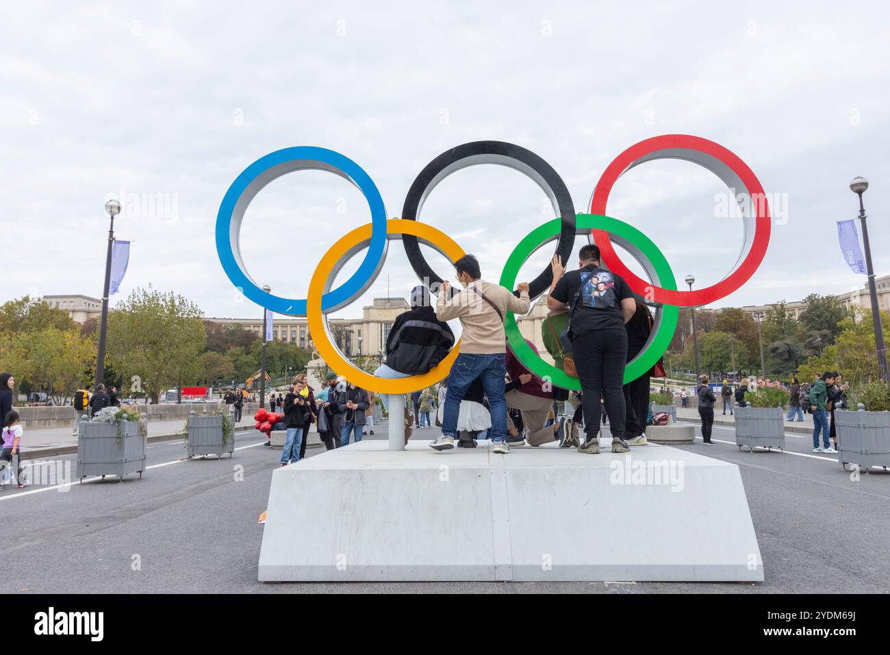 People posing with the Olympic rings in Paris, France Stock Photo - Alamy