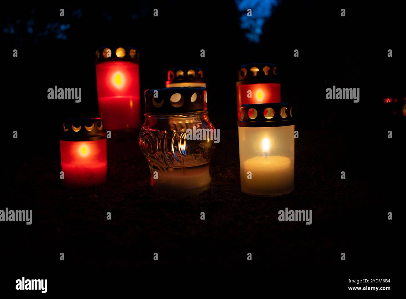 Grave candles glowing in hi-res stock photography and images - Alamy