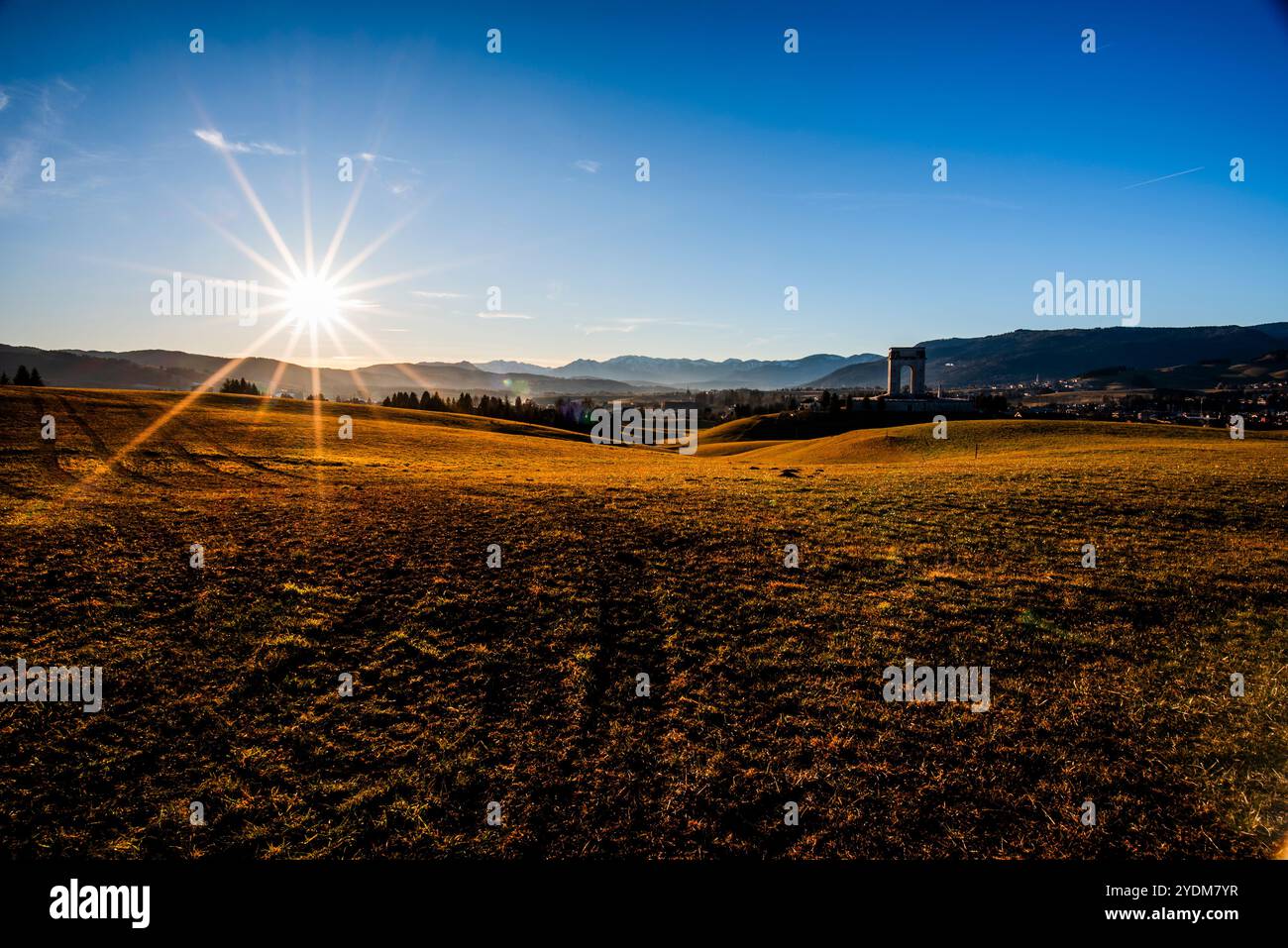 arid mountain path with stones marking the route and barbed wire ...