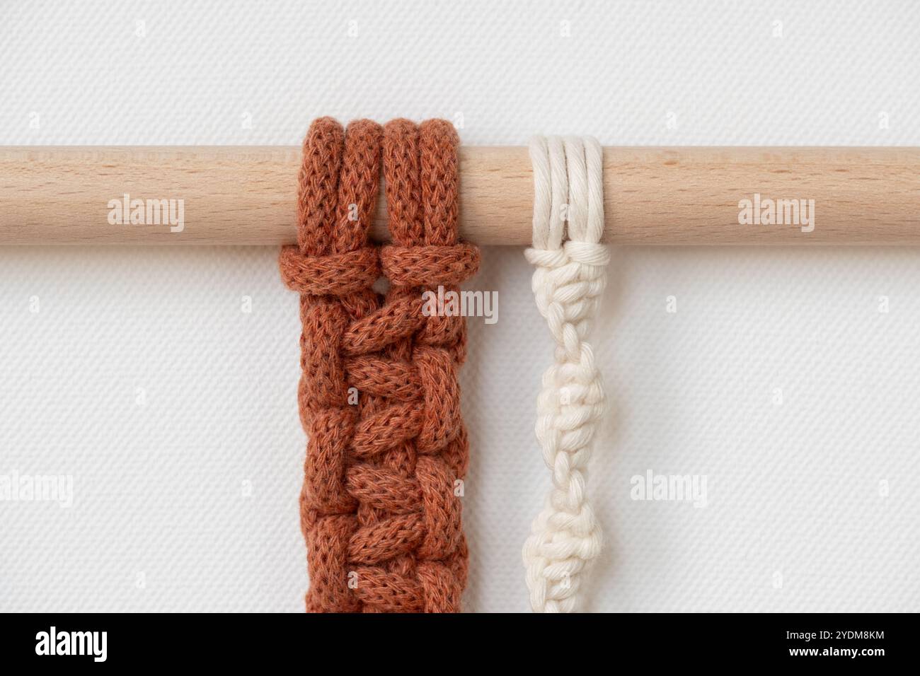 Macrame knots for beginners attached to a wooden stick. Terracotta ...