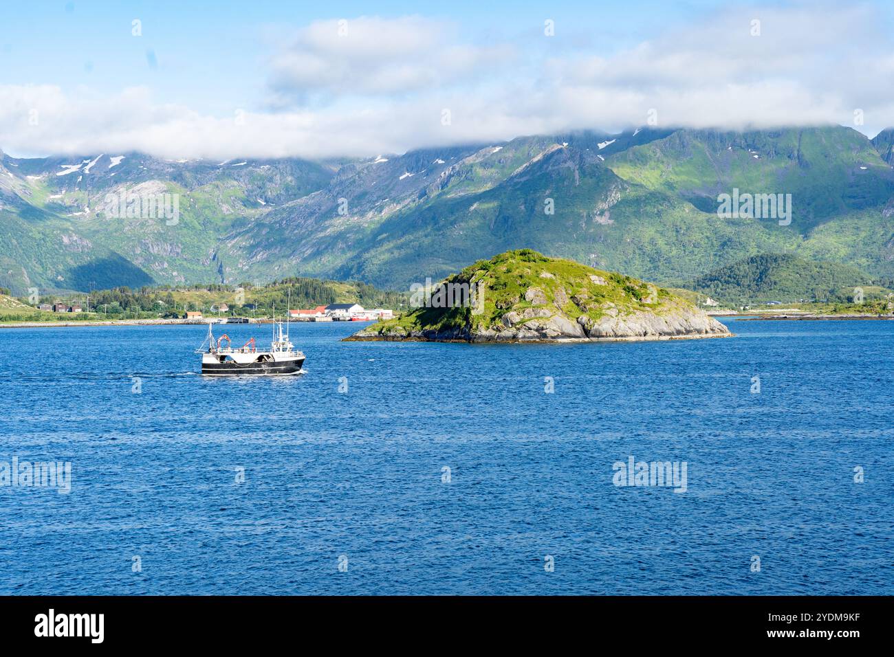 Landscape of small ship in Gimsoystraumen strait in the Lofoten islands ...