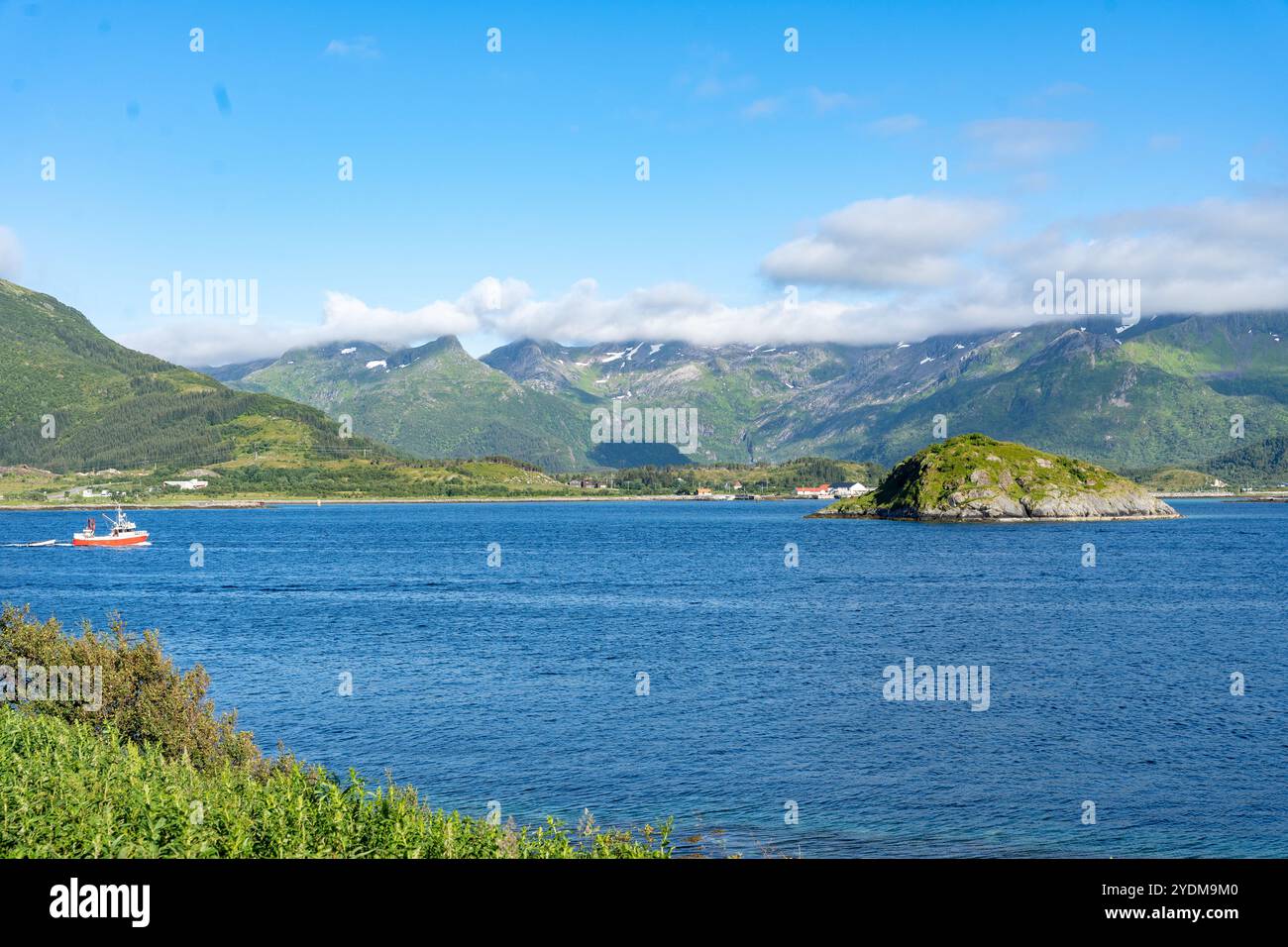Landscape of small ship in Gimsoystraumen strait in the Lofoten islands ...