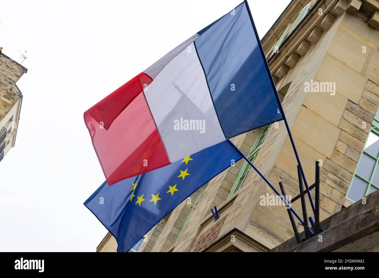 The flag of France in front of European Union flag in Paris, France ...