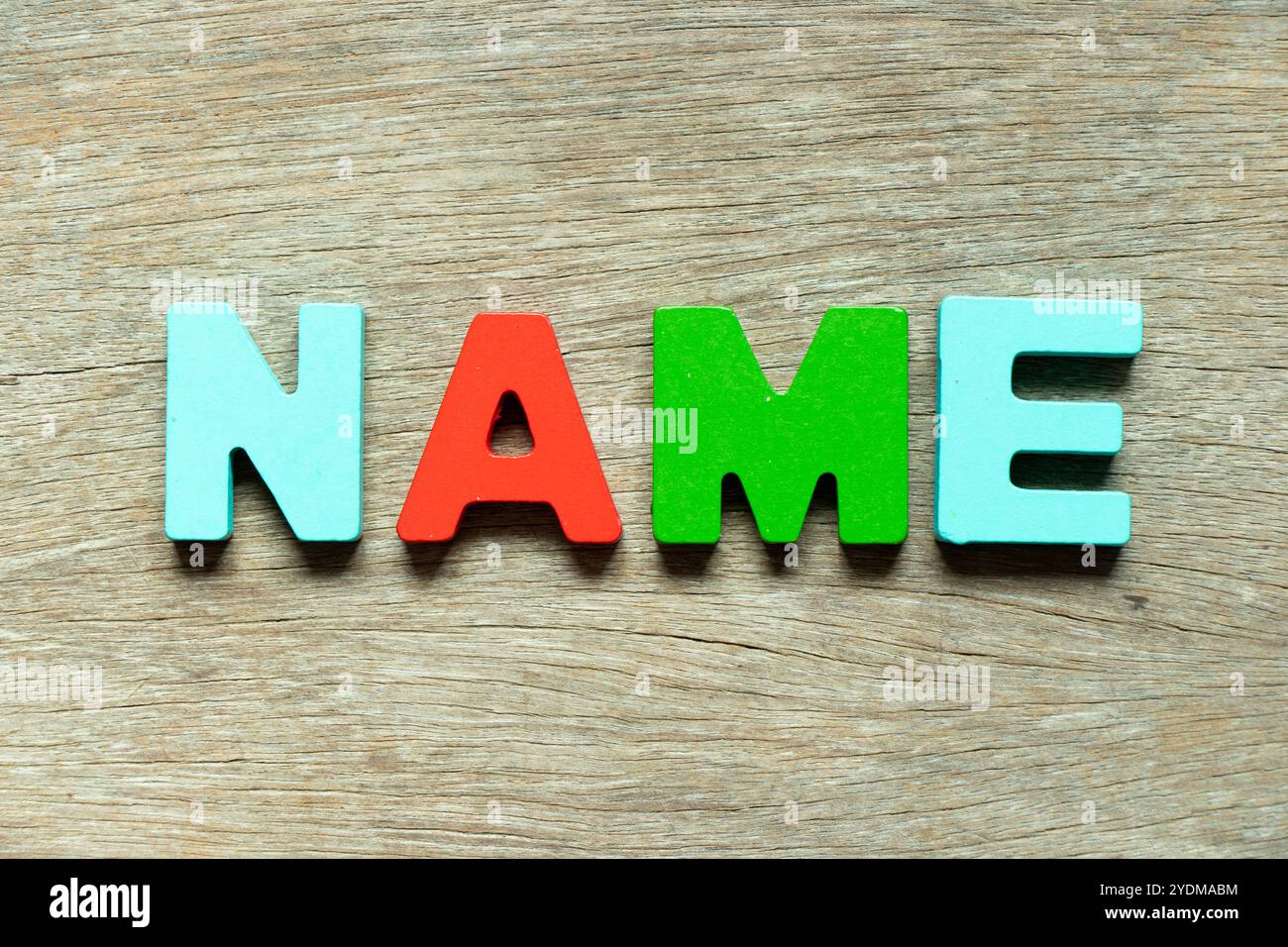 Color alphabet letter in word name on wood background Stock Photo - Alamy