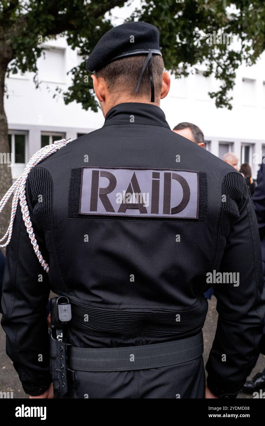 RAID unity writing on the back of a student police officer the ...