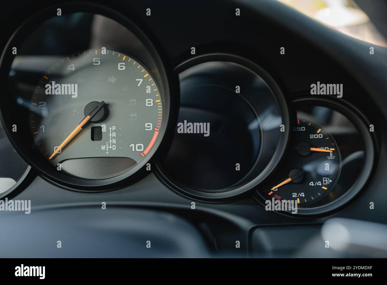 Close-up view of a car's dashboard gauges showing speedometer and tachometer with detailed ...