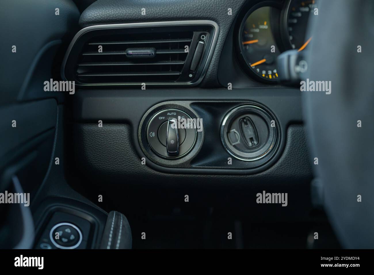 Dashboard controls for headlight settings and air ventilation in a ...