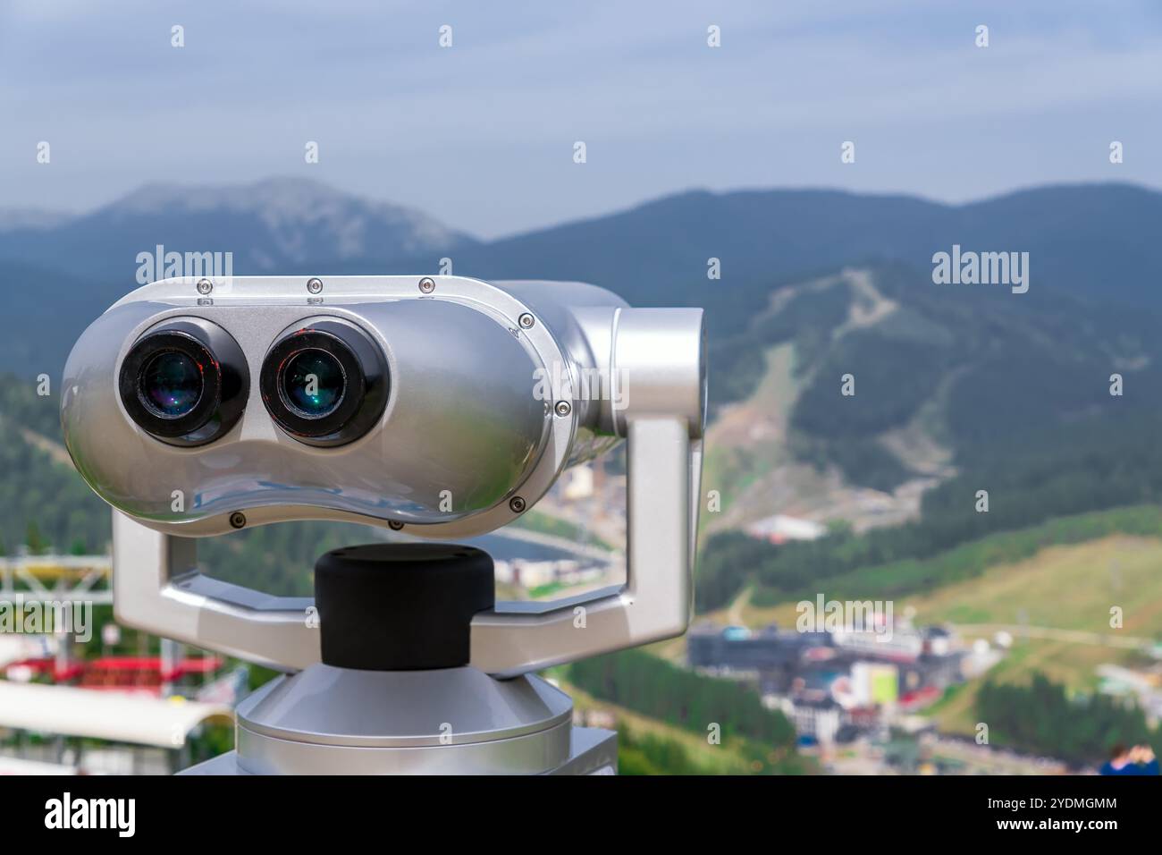 Coin-Operated Binoculars against mountain landscape. Mountain ...