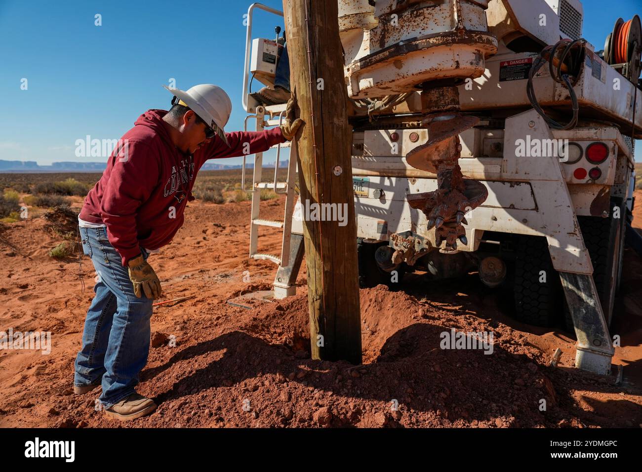 Ryan Smith, left, a foreman with the Navajo Tribal Utility Authority ...