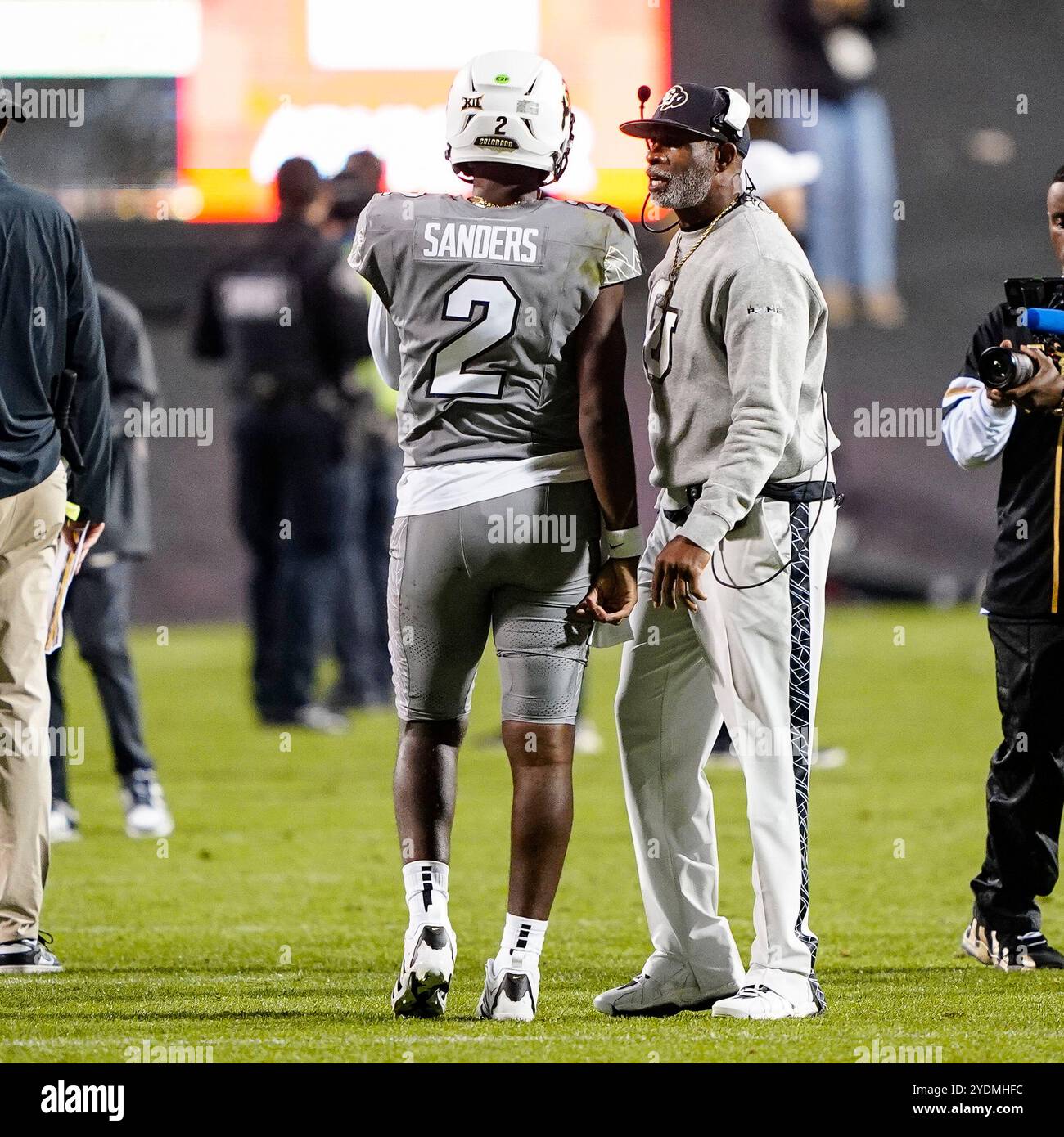 Boulder, CO, USA. 26th Oct, 2024. Colorado Buffaloes head coach Deion Sanders chats with his son ...
