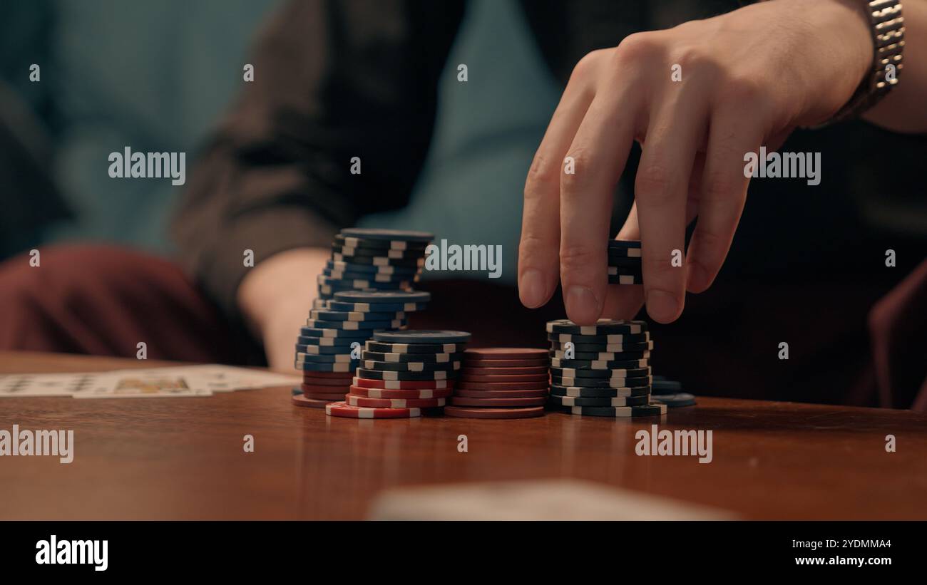 Hand gambler checking playing cards hi-res stock photography and images ...