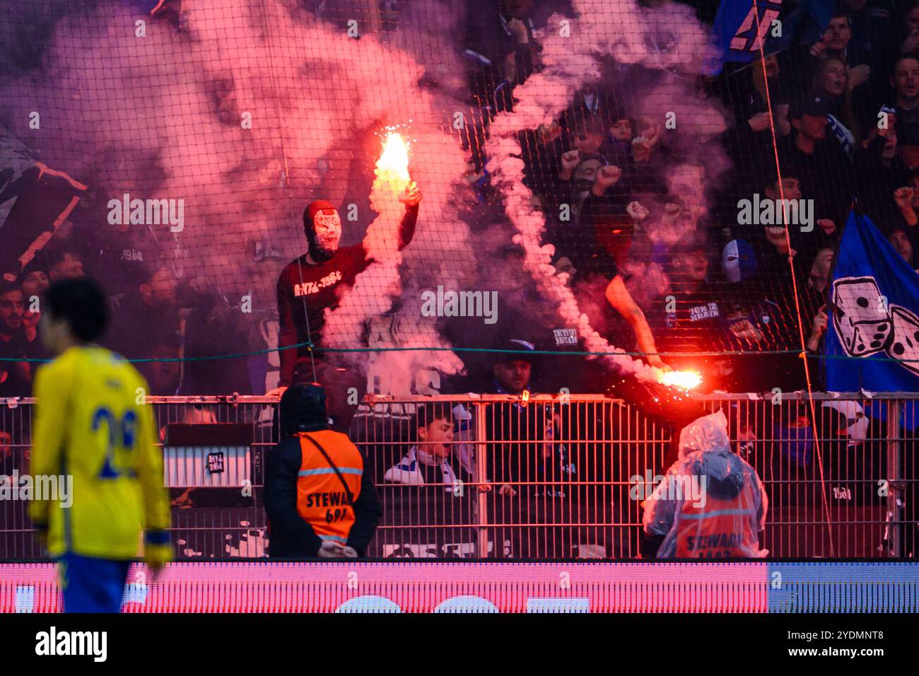 Brondby, Denmark. 27 October, 2024. Pictured left to right, FCK fans, Sektion 12, Roman candles ...