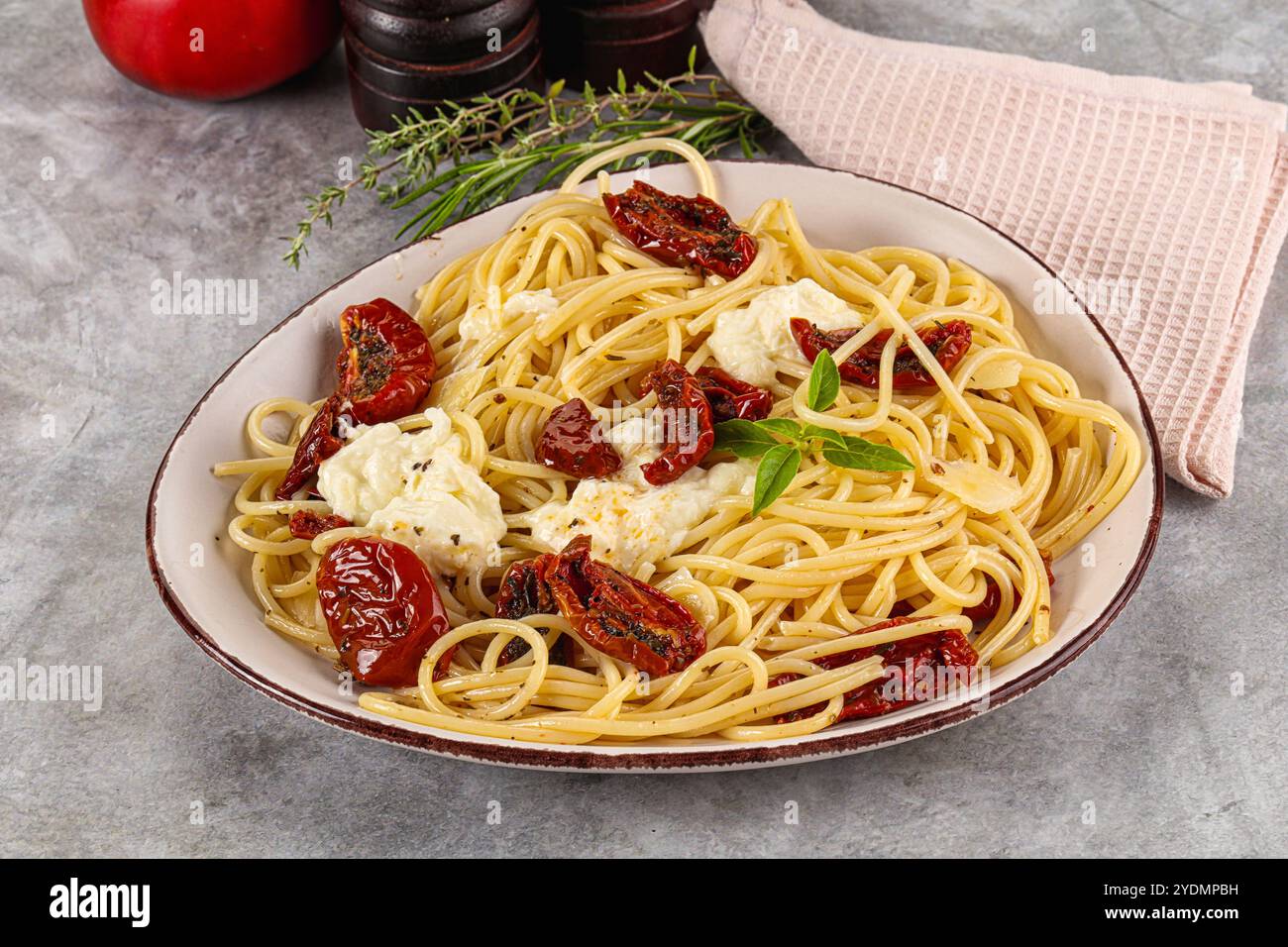 Italian pasta spaghetti with stracciatella and tomato Stock Photo - Alamy