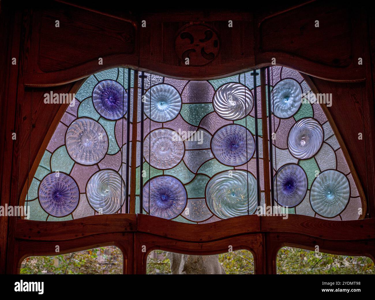 Barcelona, Spain. 27th Oct, 2024. Undulating wooden doors and stained ...