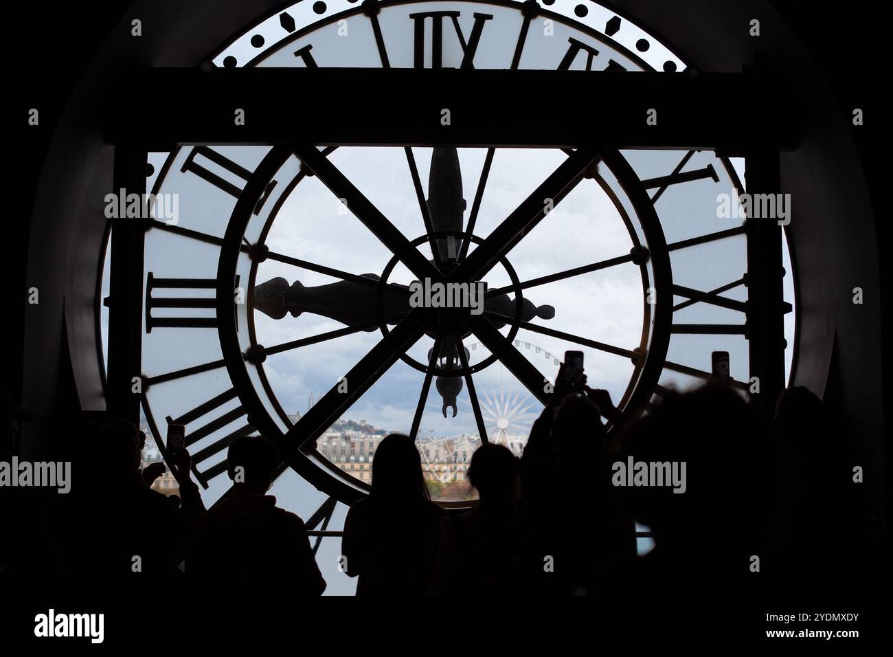Group of people behind a clock at 'Orsay Museum in Paris Stock Photo ...