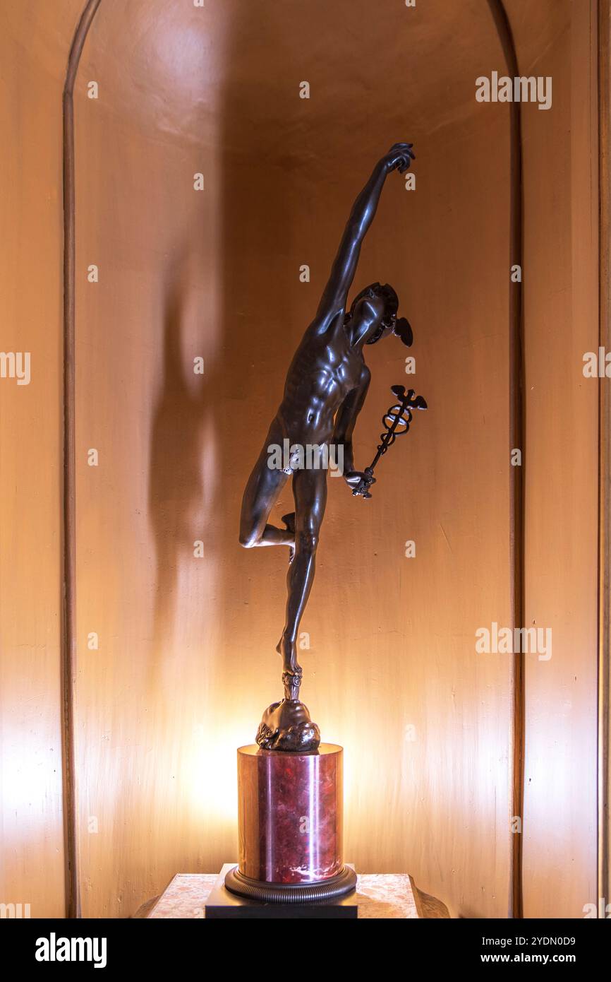 Medieval statue of a man holding a medicine caduceus Stock Photo - Alamy