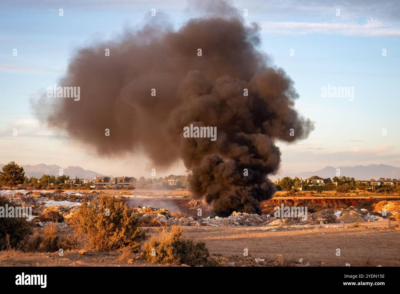A fire in a garbage dump. Dumpster fire Stock Photo - Alamy