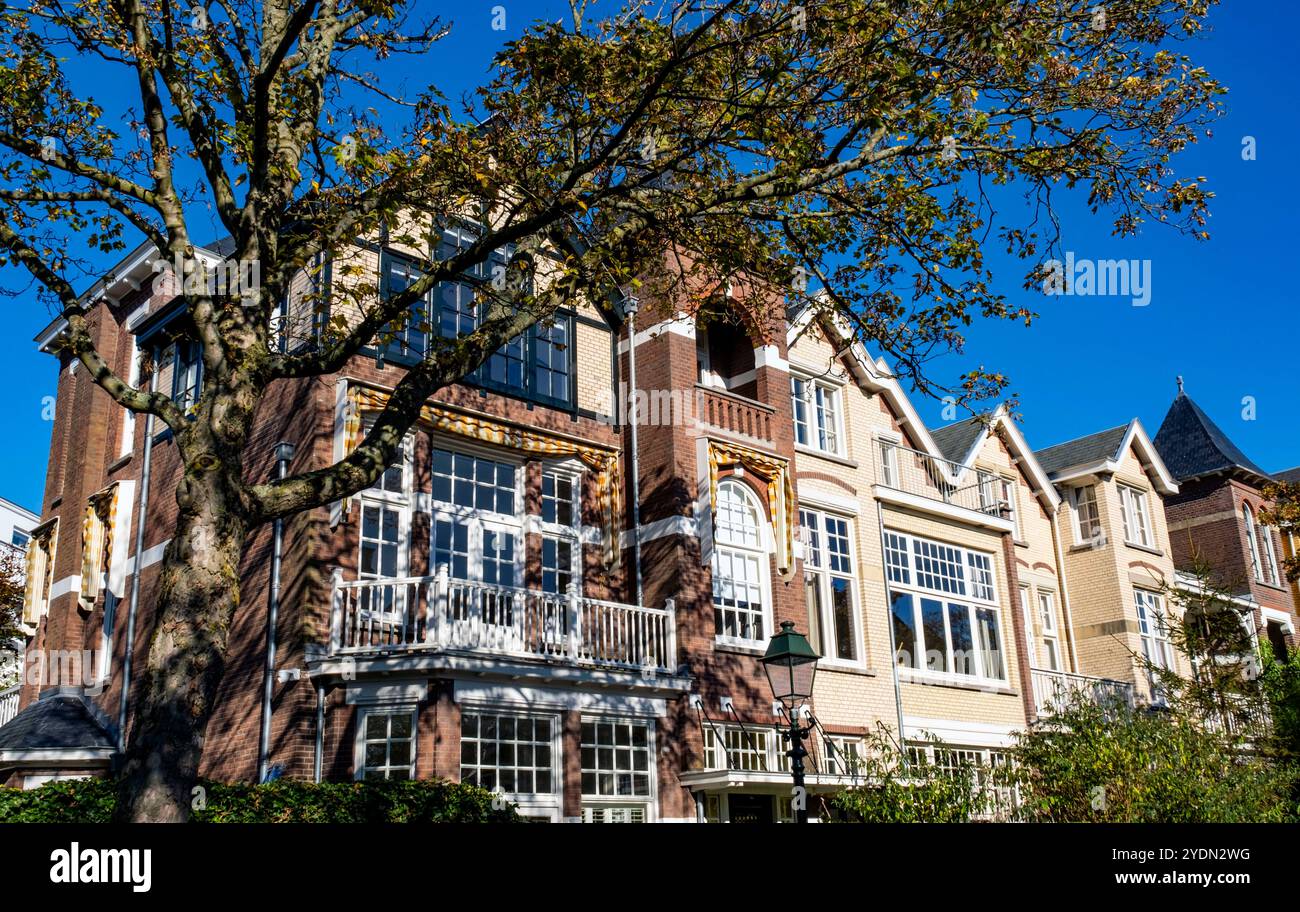 Typical Dutch cityscape on the sunny day with streets, a calm canal ...