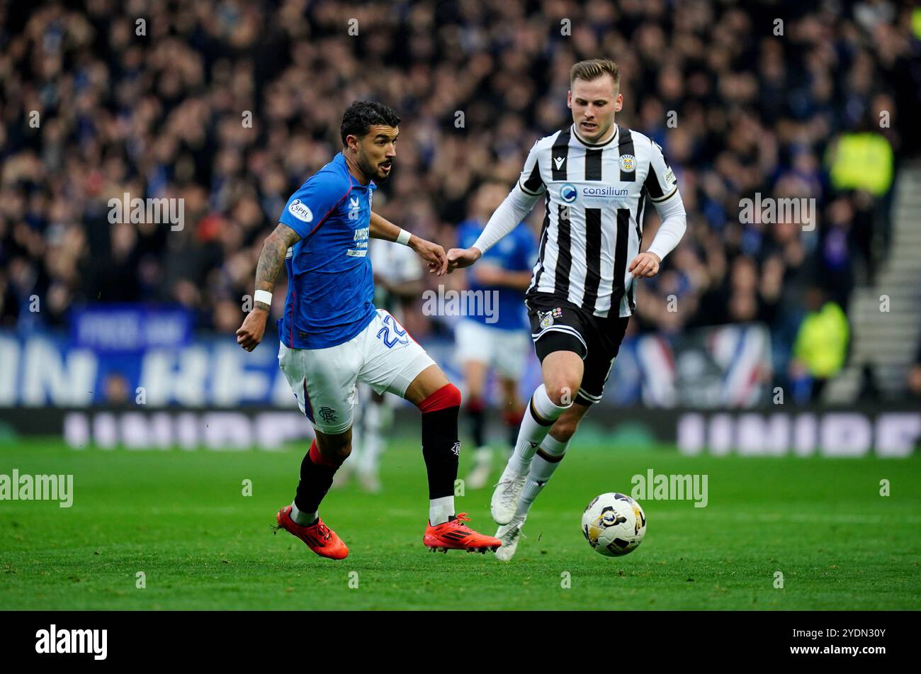 Rangers' Jefte (left) and St Mirren's James Scott (right) battle for ...