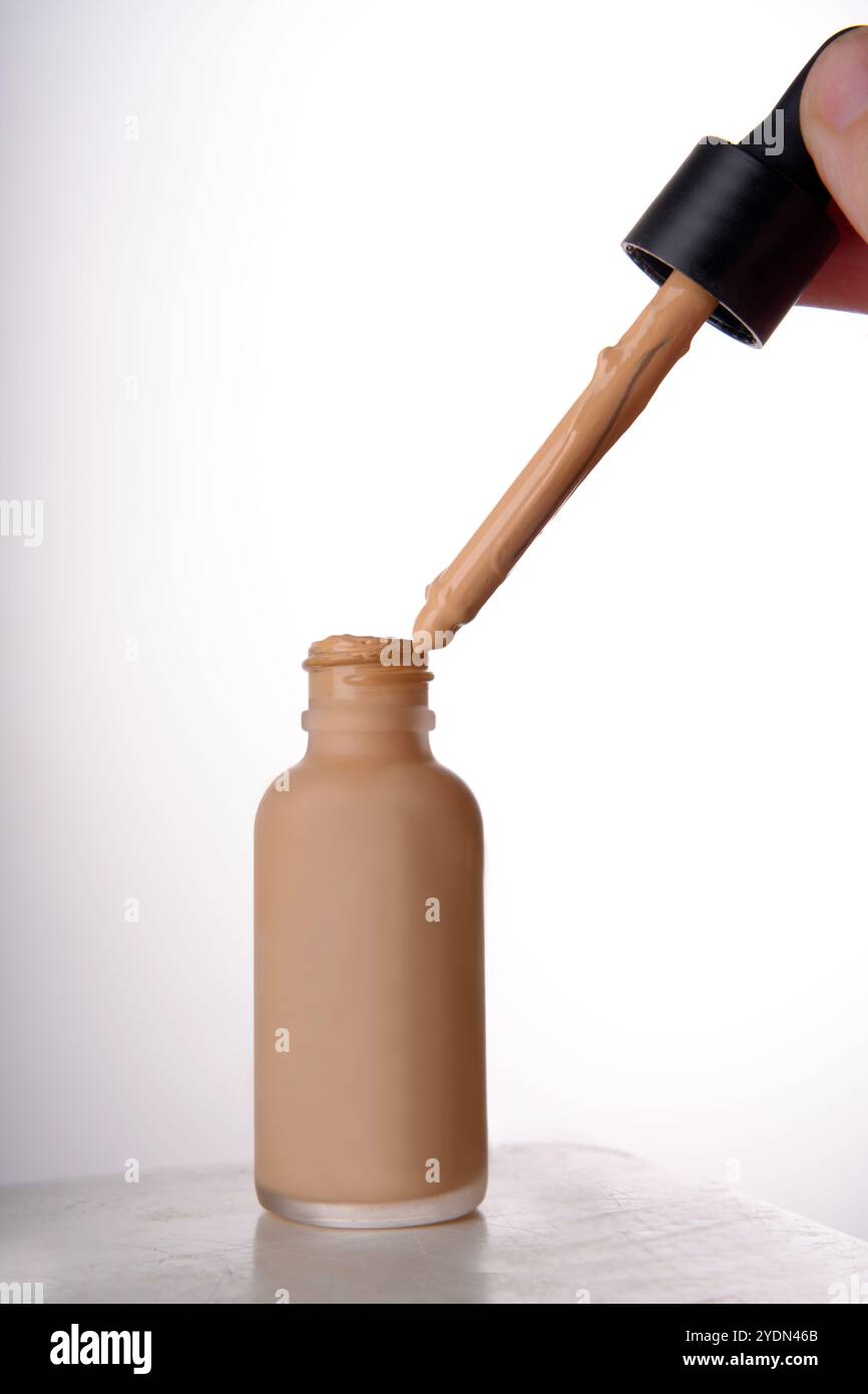 light-colored foundation base with applicator Stock Photo - Alamy