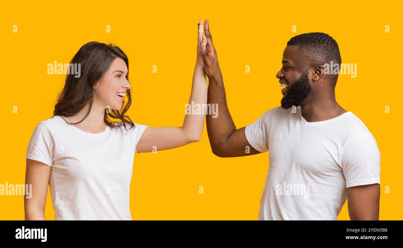 Happy Interracial Couple Giving Each Other High Five, Clapping Palms ...