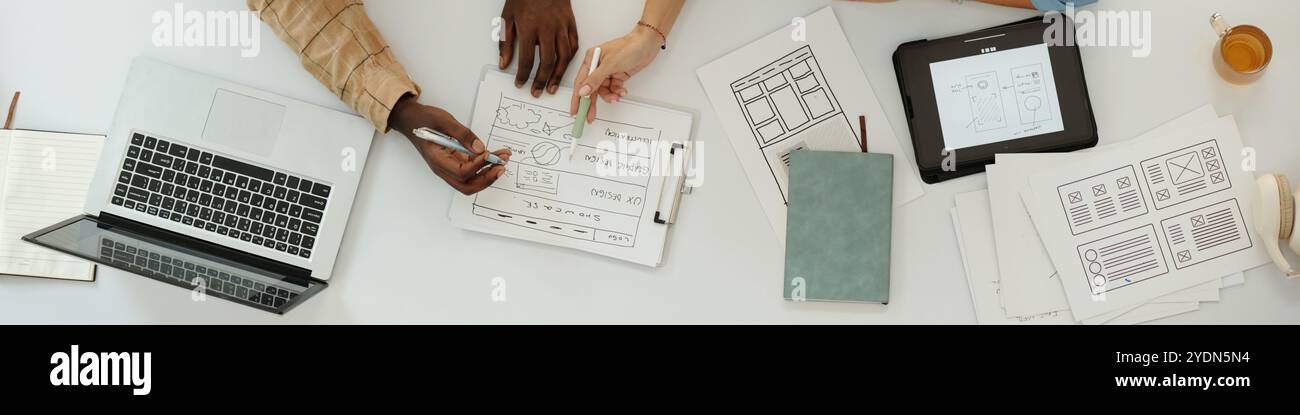 Collaborative Team Discussing Design Plans Stock Photo - Alamy