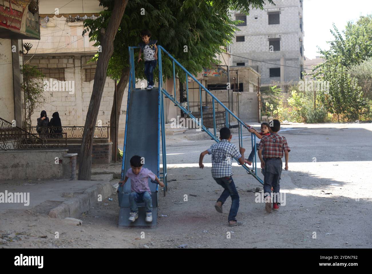 Syrian children playing during Eid al-Adha while a truce is in place ...