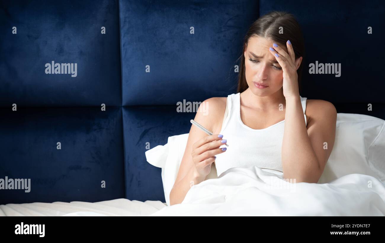 Sick Woman Having Fever Measuring Temperature Sitting In Bed Stock ...