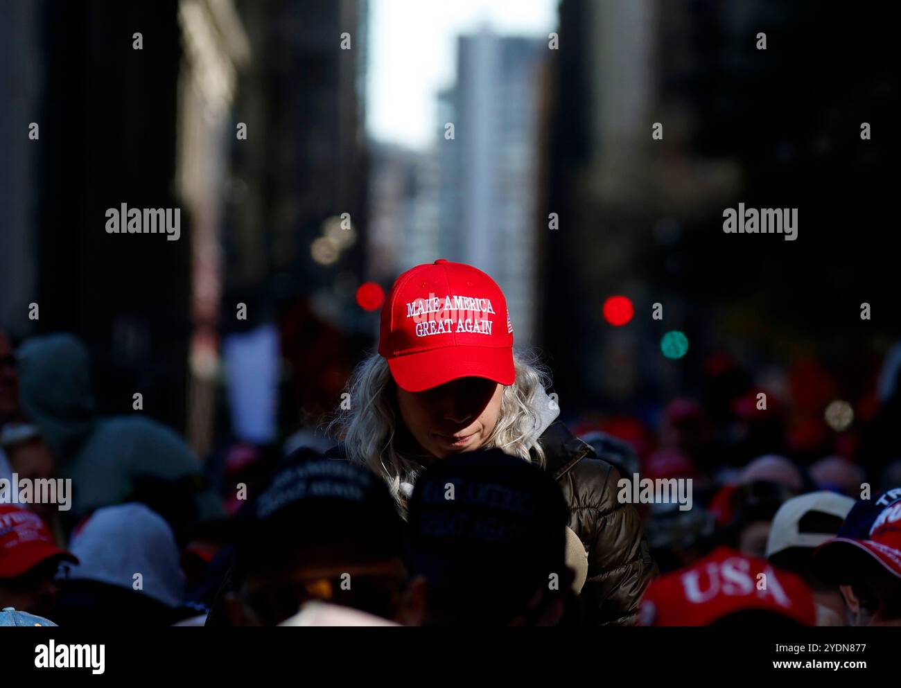 New York, United States. 27th Oct, 2024. Supporters hold flags and wear ...