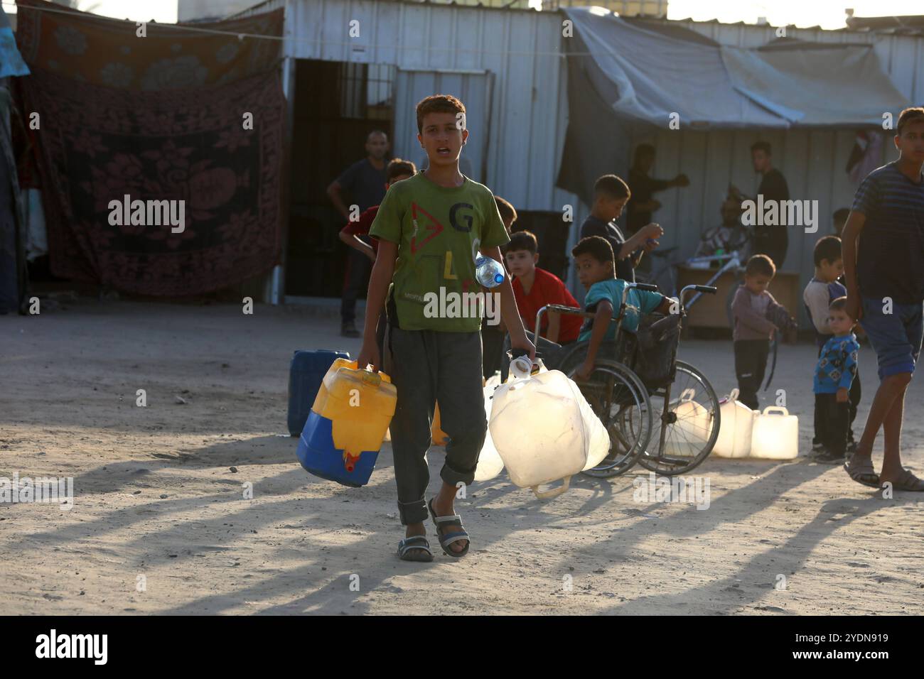 Displaced Palestinian children are seen at a temporary shelter in the ...