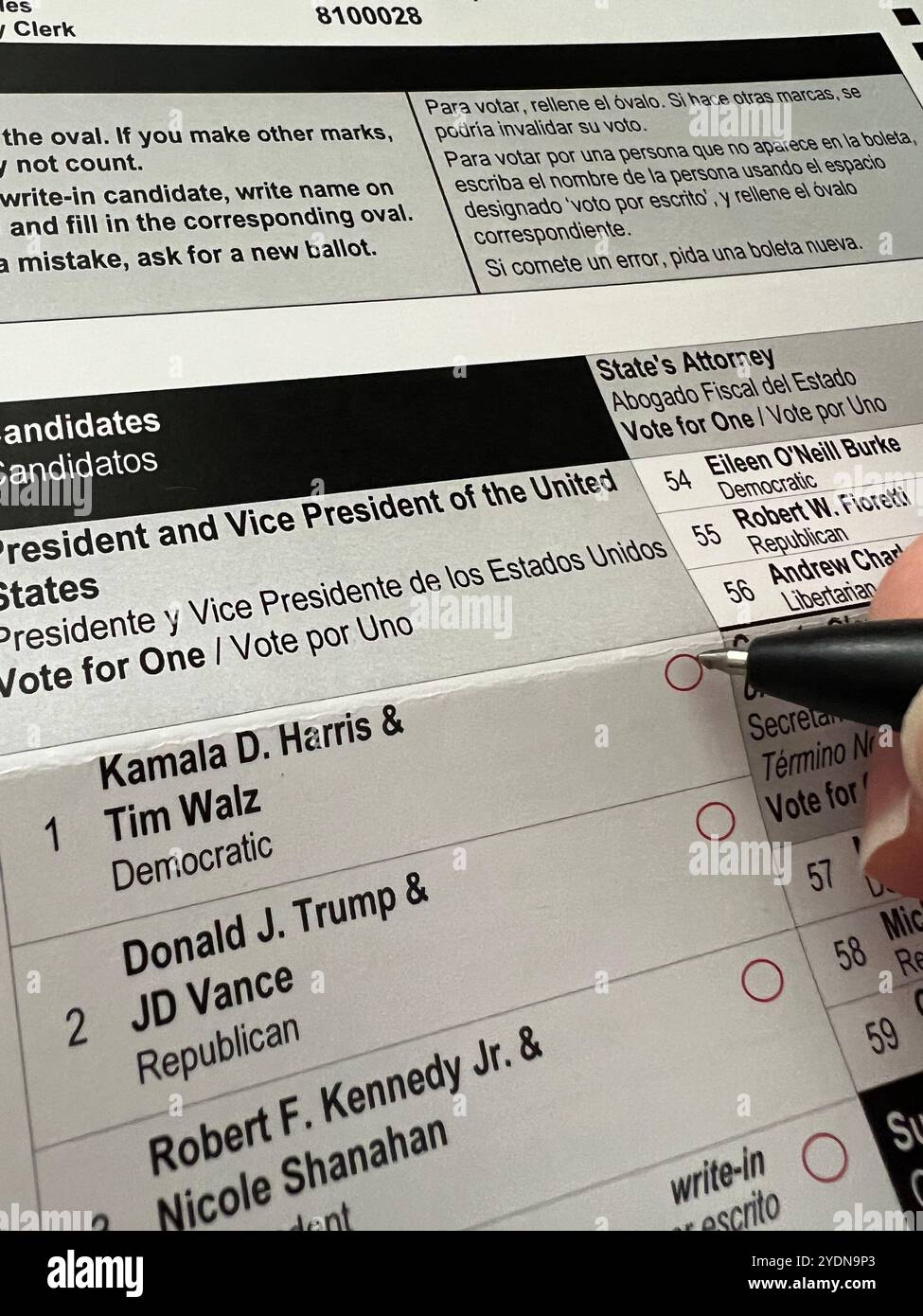 Female white hand marking a mail-in ballot to vote for Kamala Harris in ...