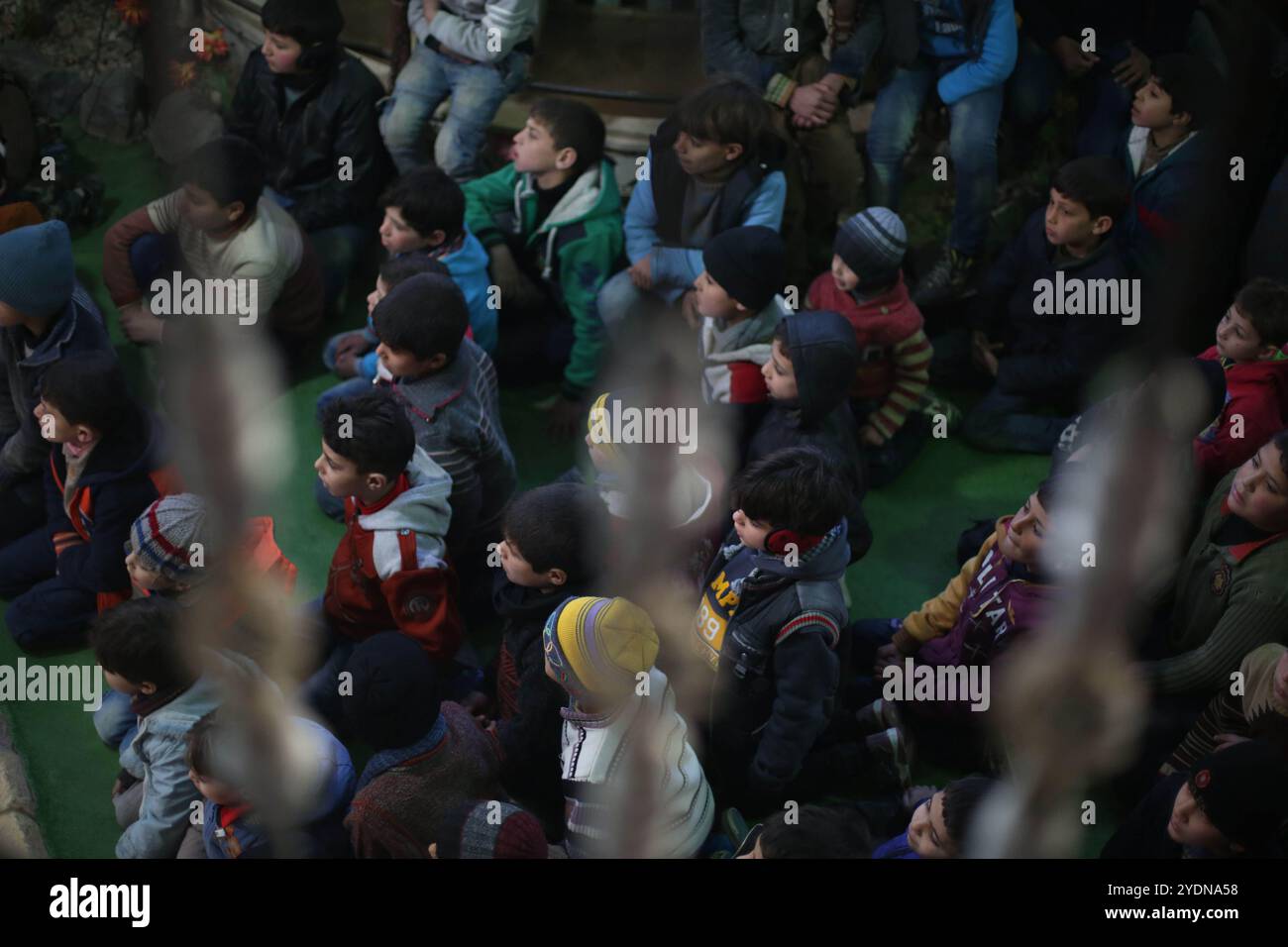 Orphan Syrian children in a playground build underground to protect ...