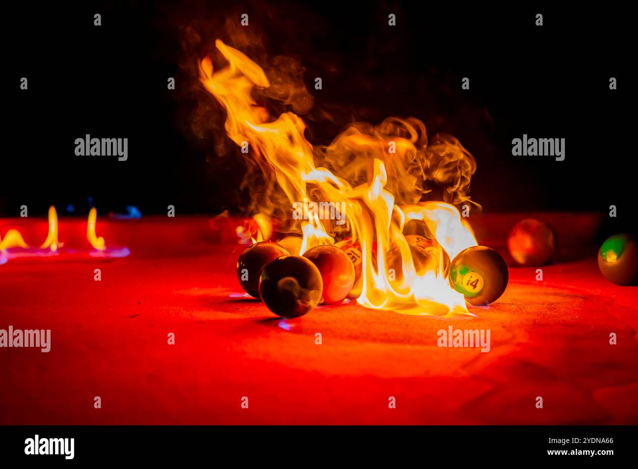 A billiard table is engulfed in flames, with blazing balls scattering ...