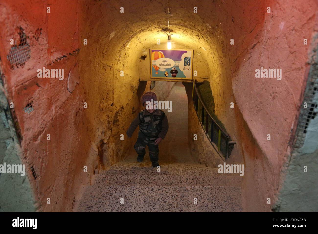 Orphan Syrian children in a playground build underground to protect ...