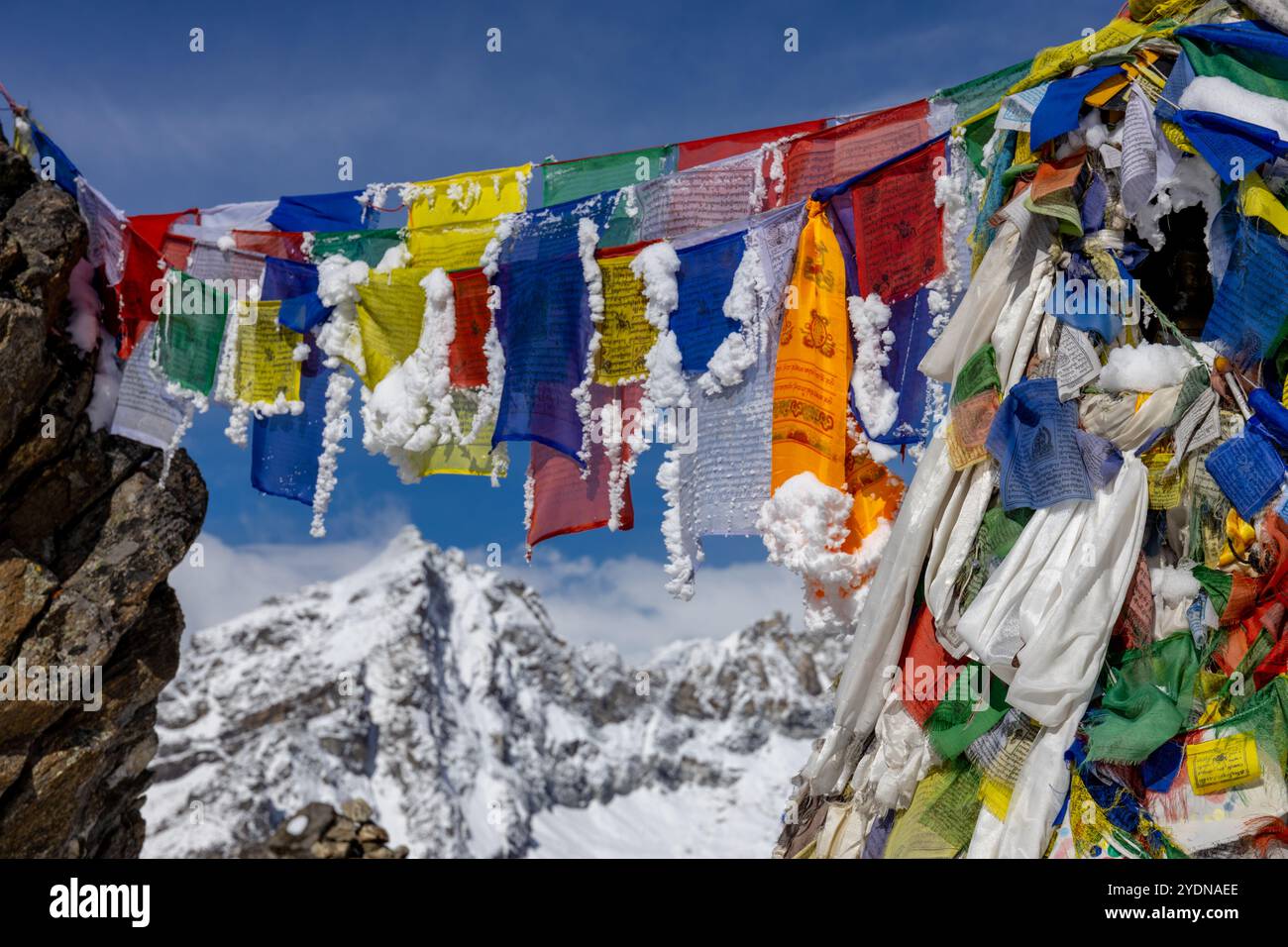 Colorful prayer flags with mantra written on it in the Himalayas ...