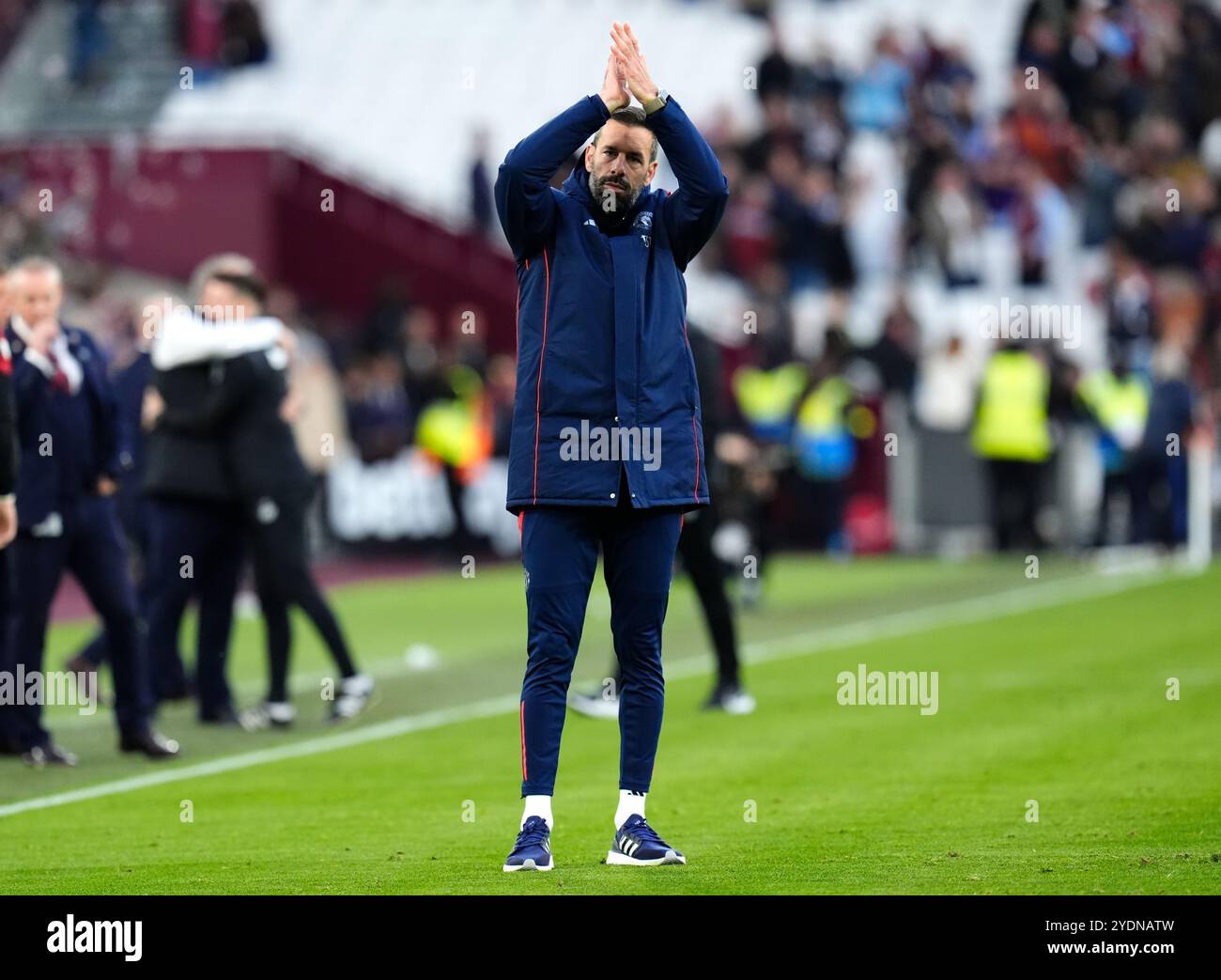 Manchester United assistant manager Ruud van Nistelrooy applauds the ...