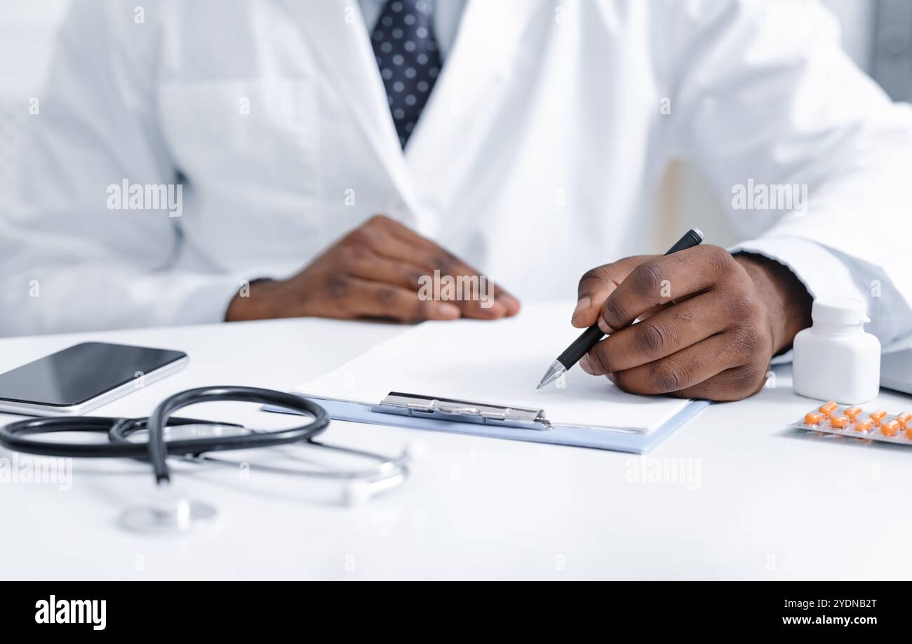 African doctor prescribing medicine hi-res stock photography and images ...