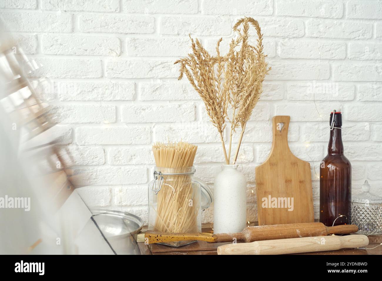 Rustic kitchen decor with wheat, cutting boards, and spaghetti against ...