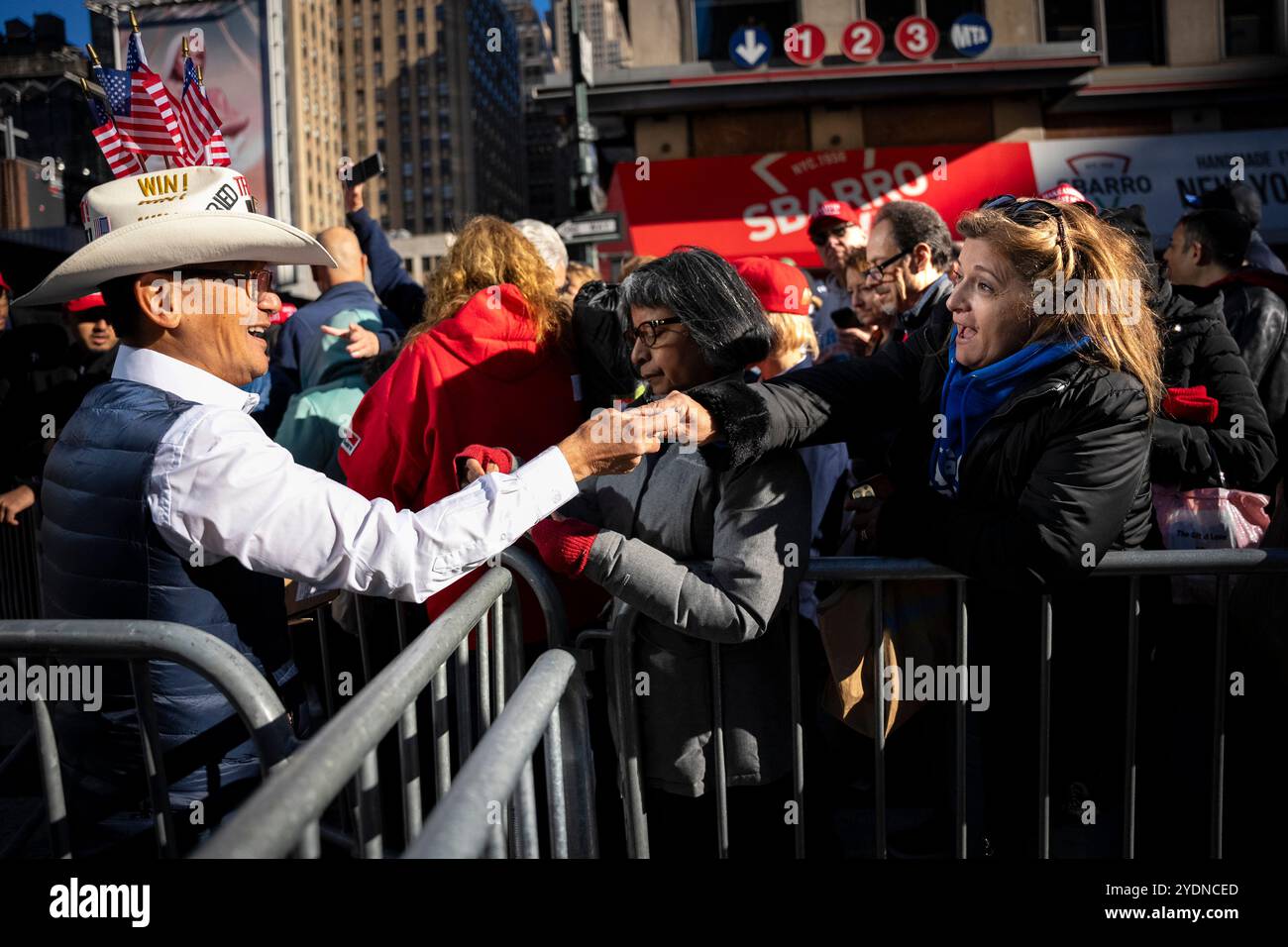 Lisa Nieves gets excited to receive a collectible Trump card while ...