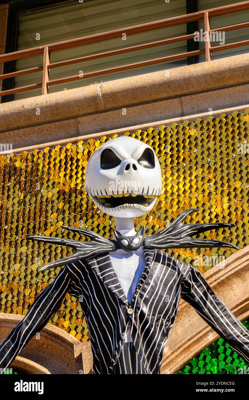 A large sculpture of a grinning skeleton jack skellington in a striped ...