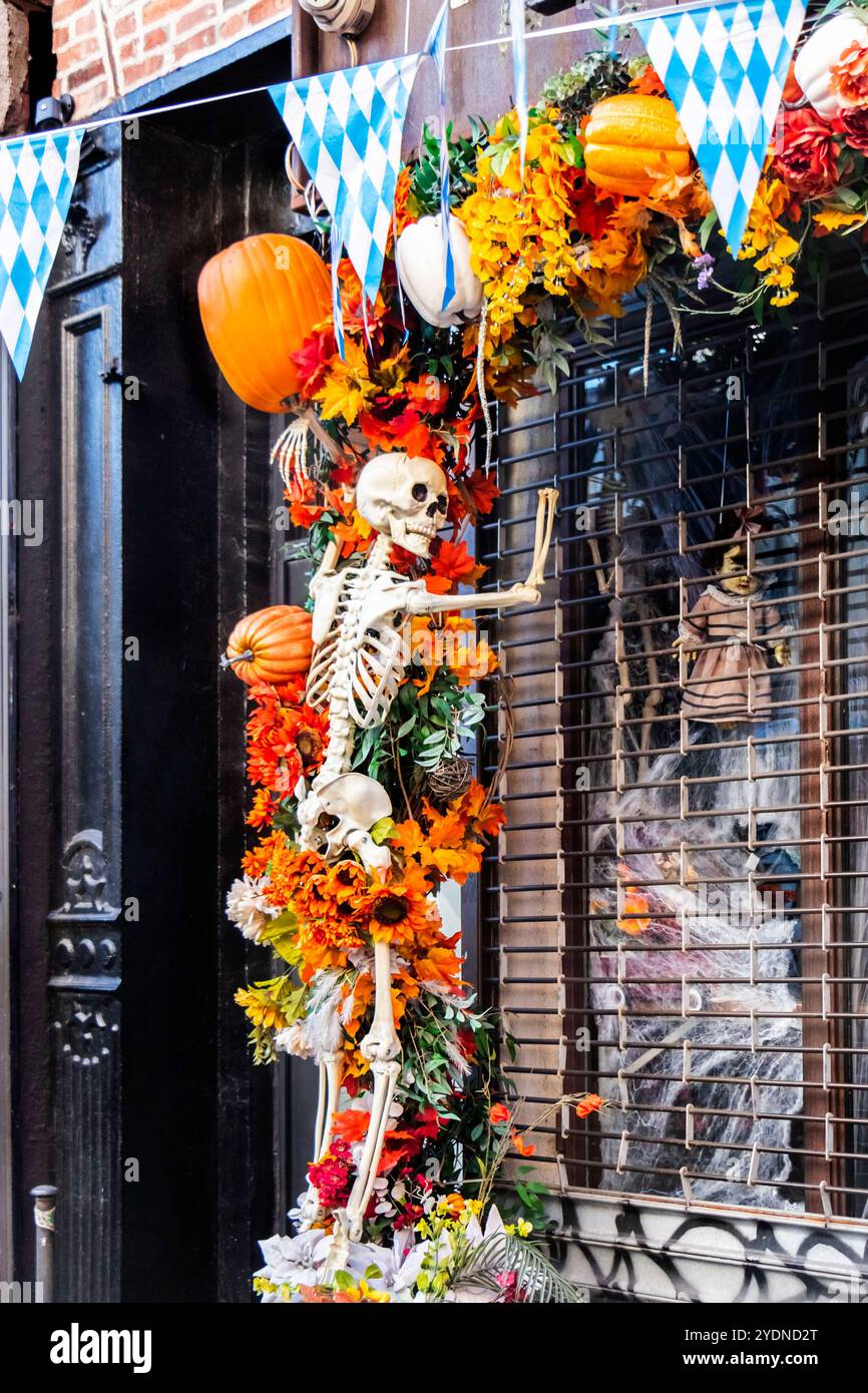 Skeleton decoration with red flowers in a festive Halloween display ...