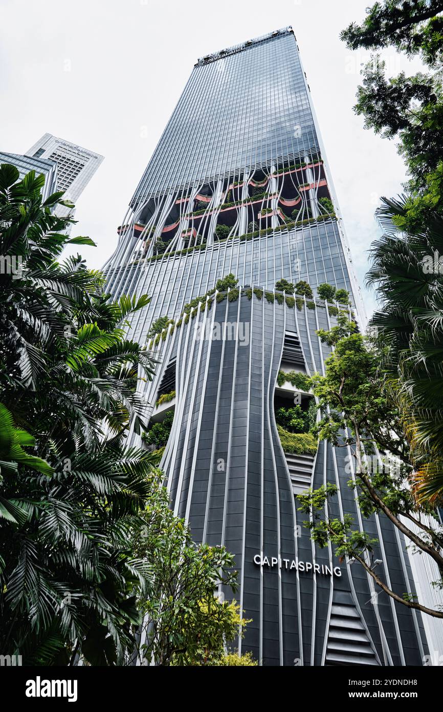 Singapore - August 12, 2024: CapitaSpring skyscraper with unique ...