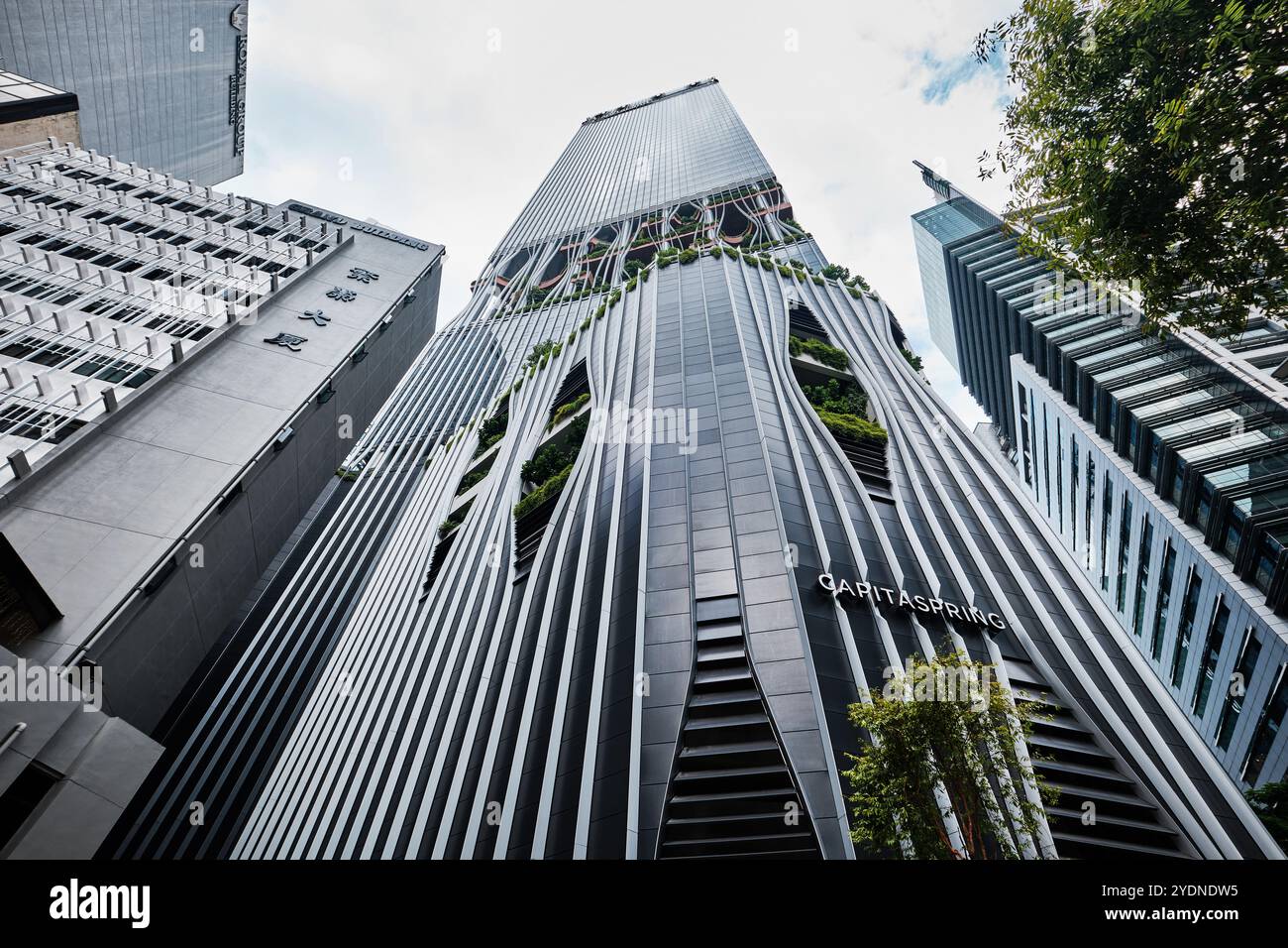 Singapore - August 12, 2024: CapitaSpring skyscraper with unique ...