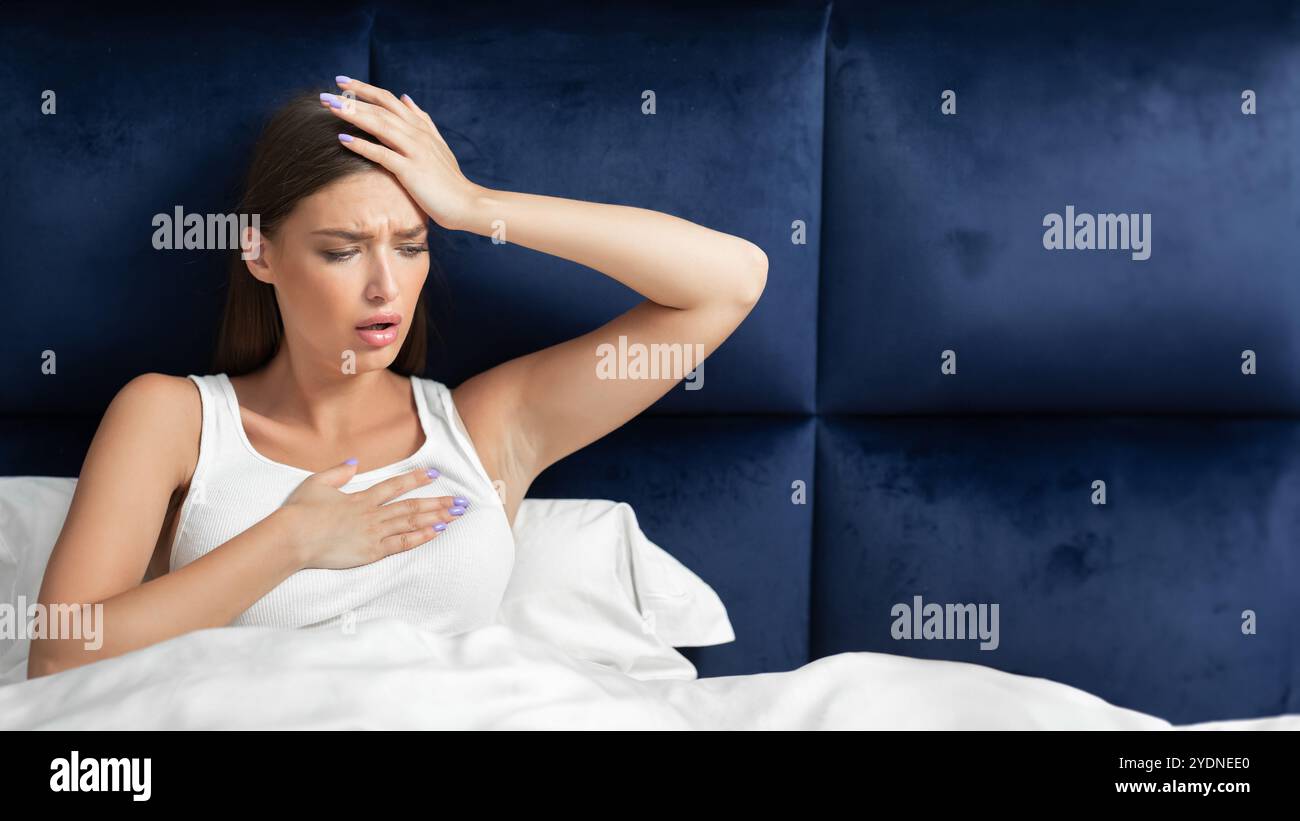 Sick Girl Coughing Heaving Fever Sitting In Bed At Home Stock Photo - Alamy
