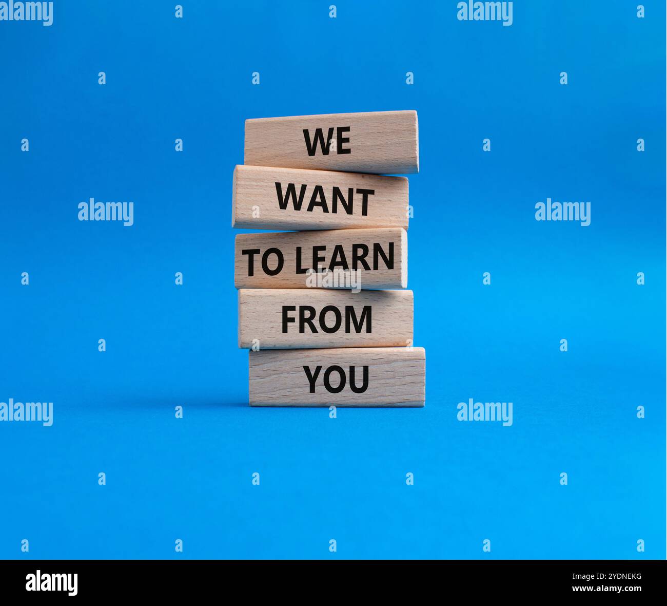 We want to learn from you symbol. Wooden blocks with words We want to ...