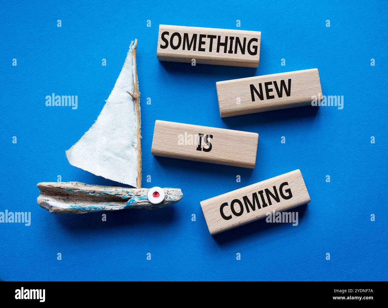 Smth New is coming symbol. Wooden blocks with words Something New is ...
