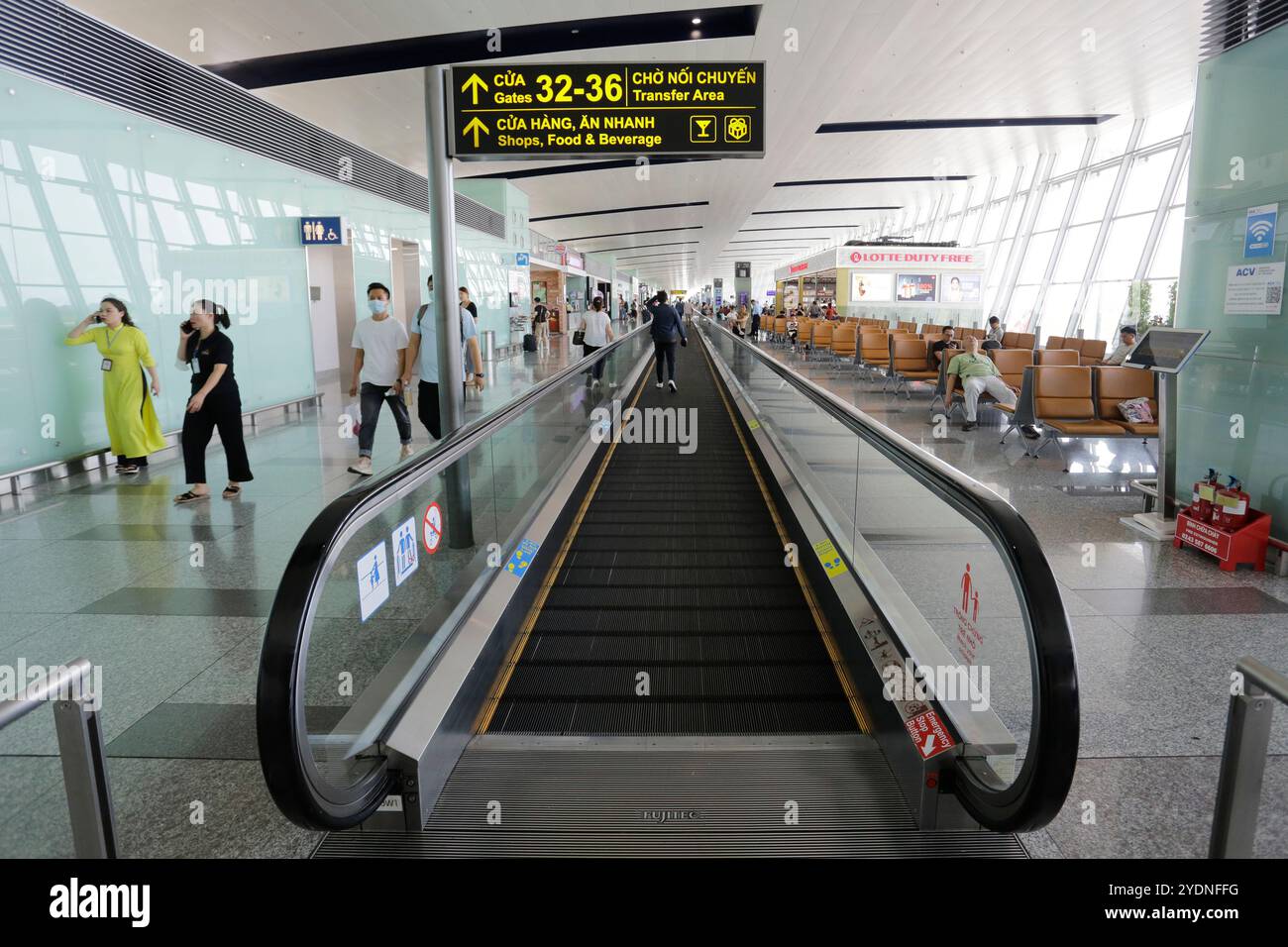 Hanoi, Vietnam - July 26, 2023: People use the moving walkway in the ...
