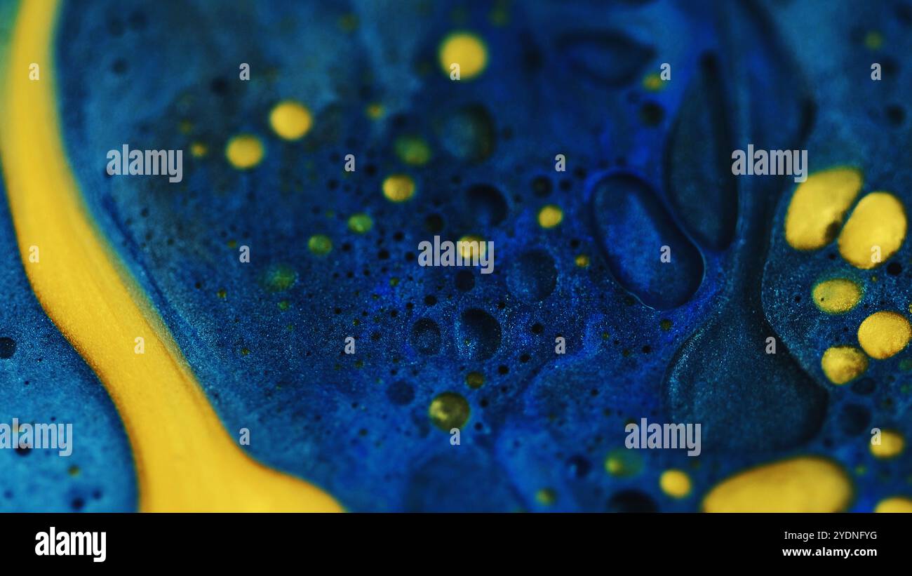 Oil paint blend. Glitter fluid. Blur blue yellow color shimmering ...